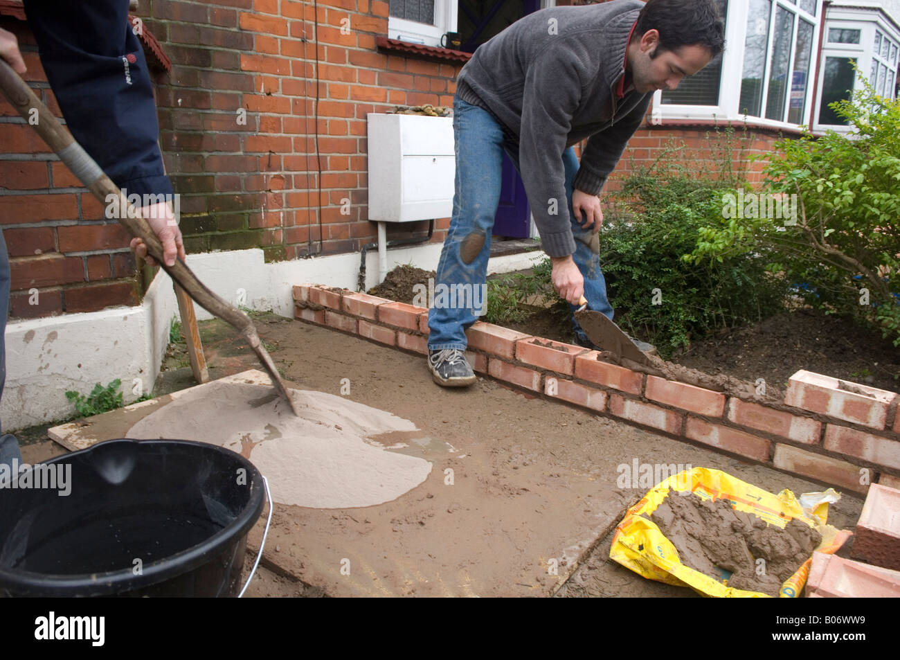 DIY How to build a brick wall Stock Photo - Alamy