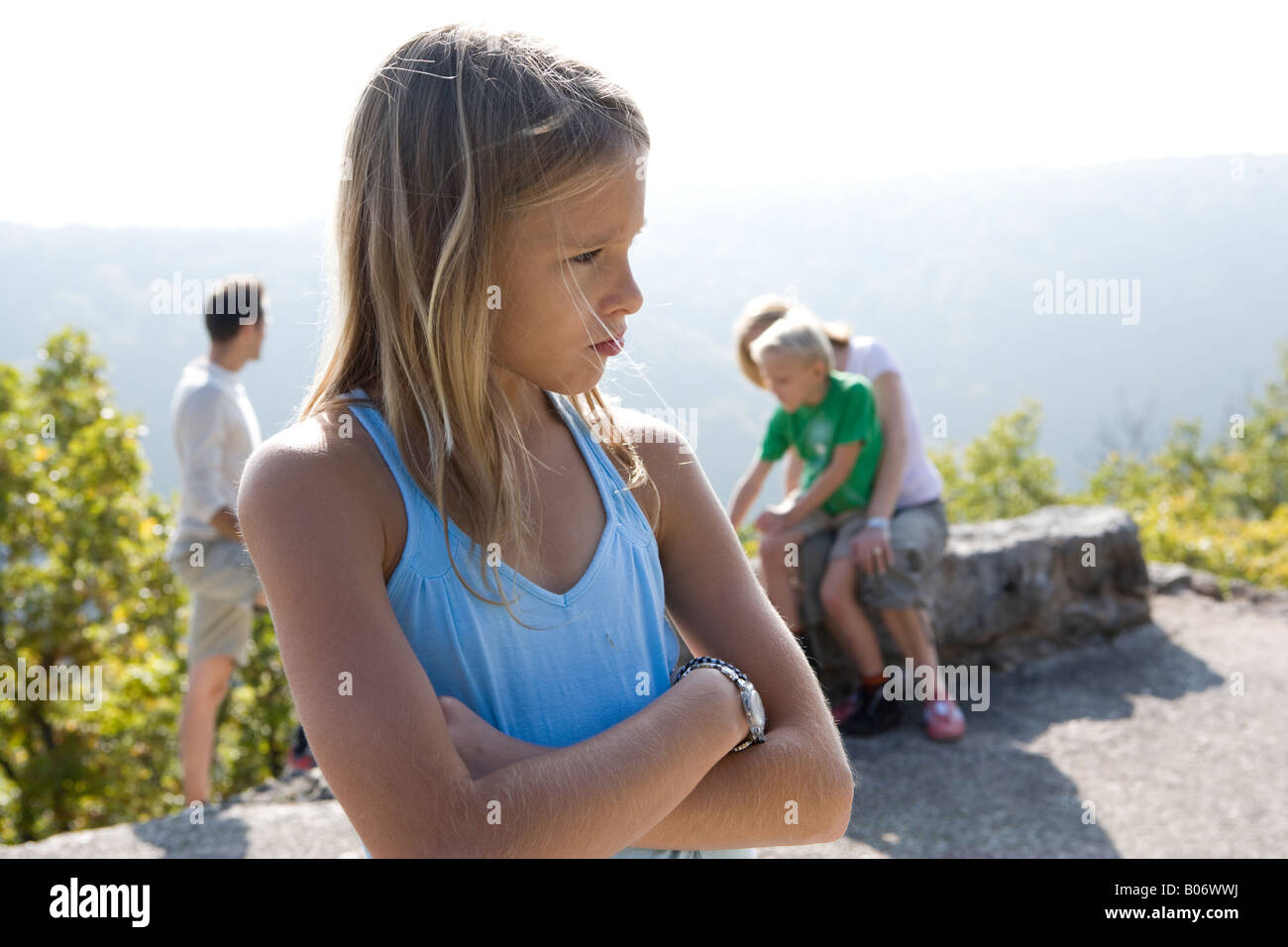 Girl apart from the family Stock Photo - Alamy
