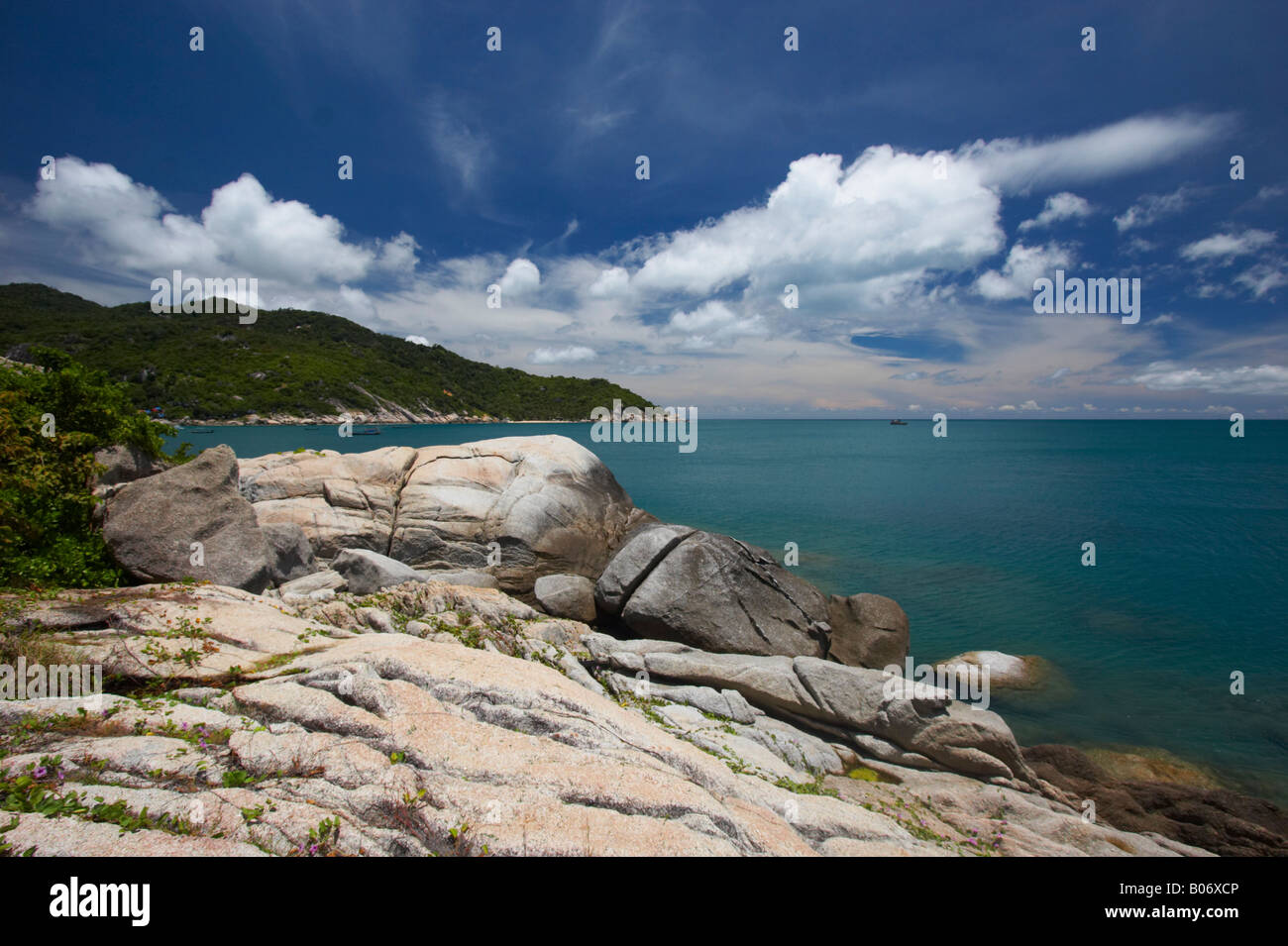 Scenic view of rocky seaside and emerald water at Haad Rin beach, Ko ...