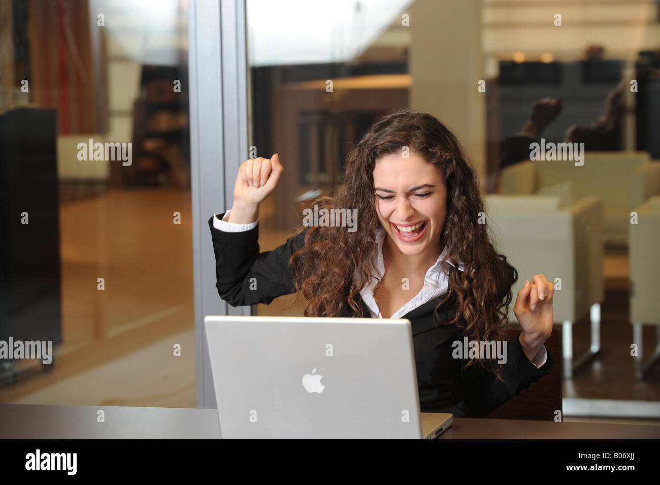 Woman at computer Stock Photo - Alamy