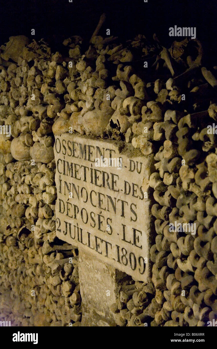 Human skulls and bones stacked in rows in the underground Catacombs ...