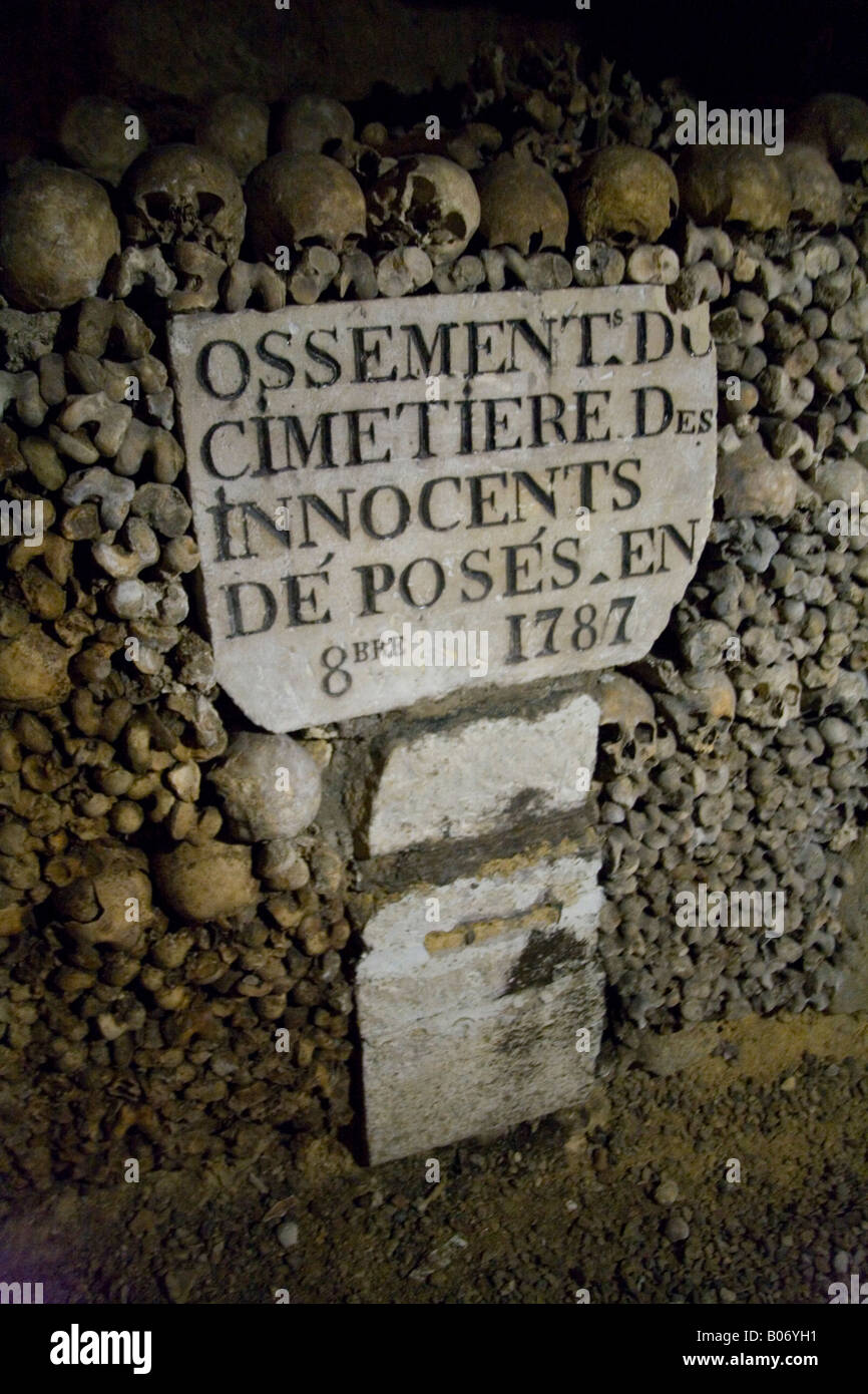 Human skulls and bones stacked in rows in the underground Catacombs ...