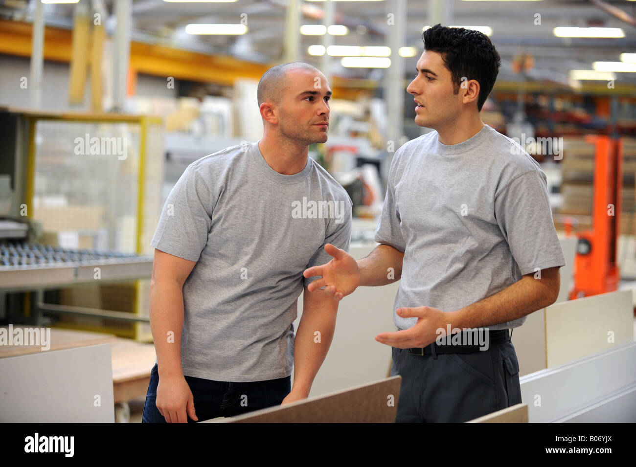 Workers in a factory Stock Photo - Alamy