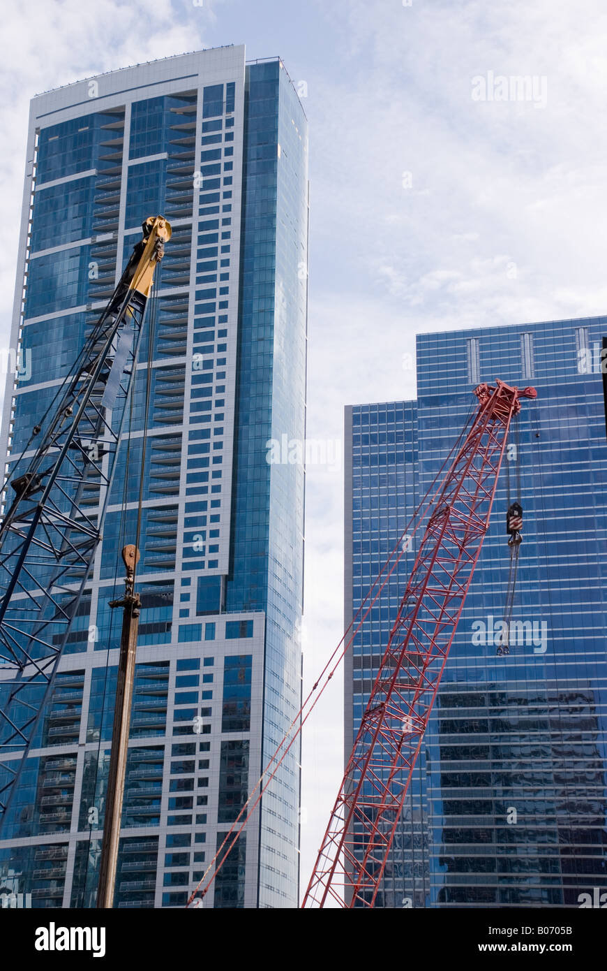Downtown glass skyscraper construction cranes hi-res stock photography ...