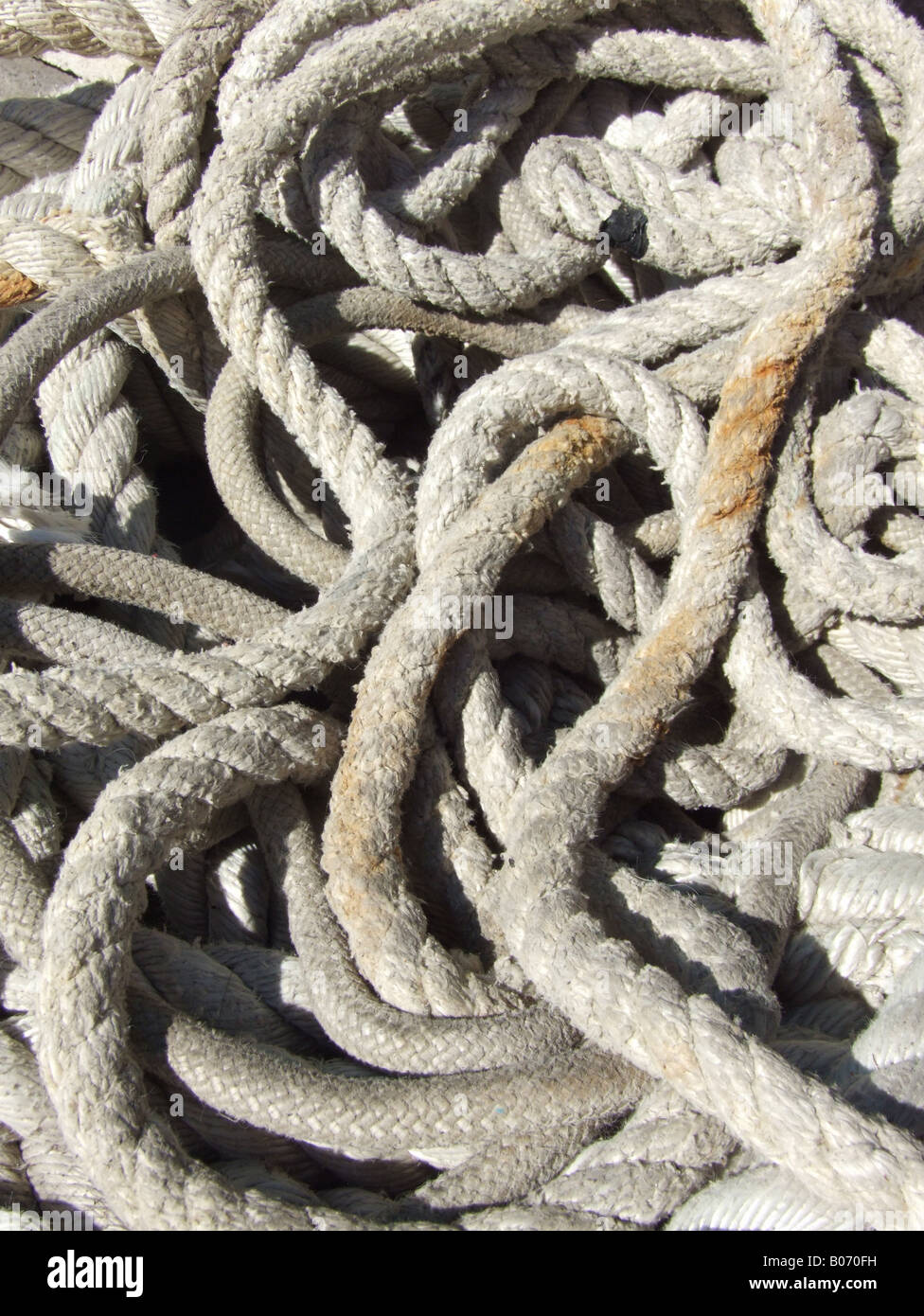 bundle of ropes in port Stock Photo - Alamy