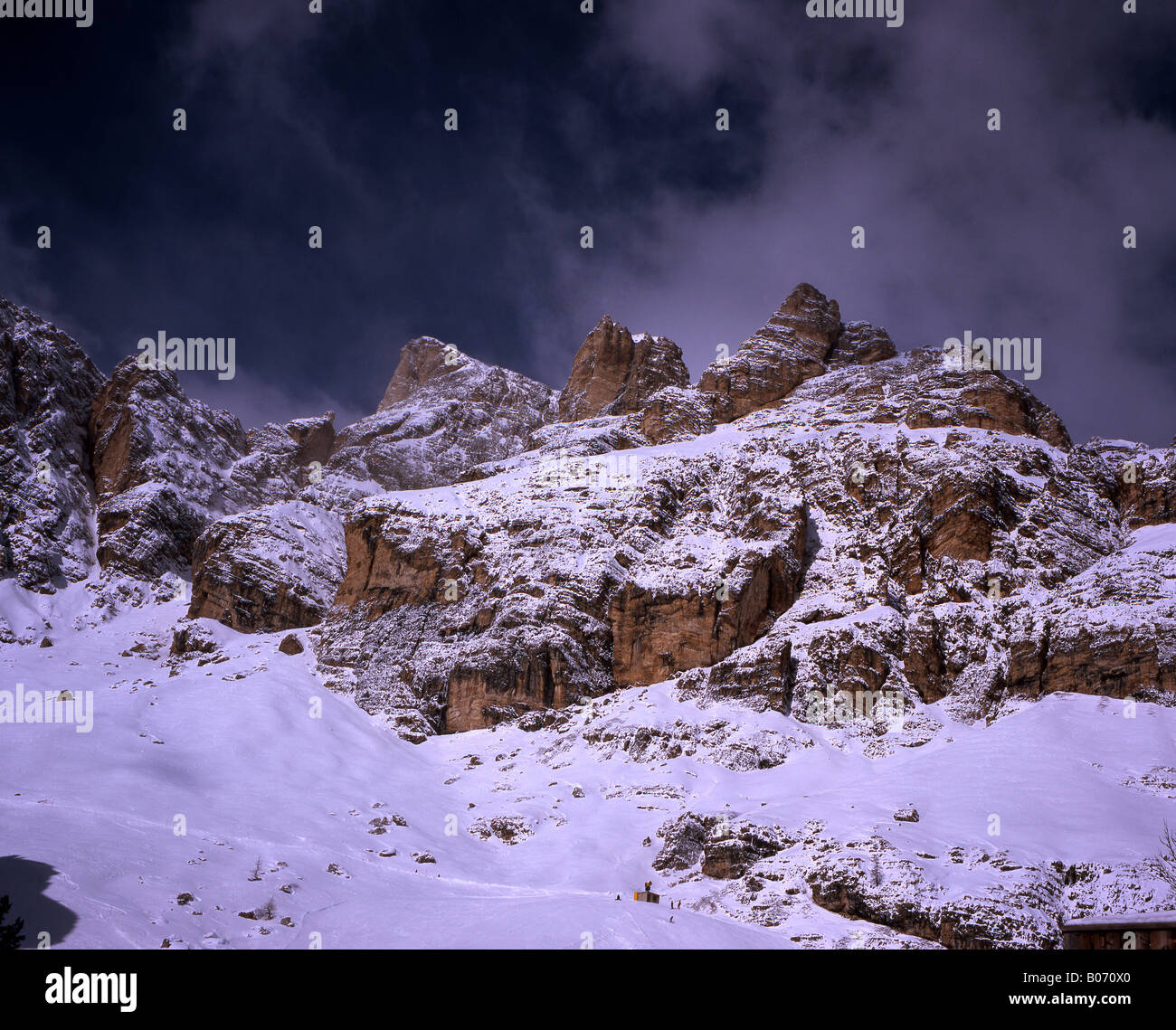 Massive limestone cliffs rising above Cortina D'ampezzo, The Dolomites ...