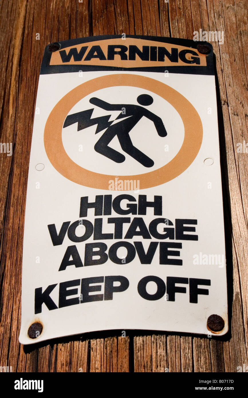 High voltage warning sign on electrical power pole Stock Photo - Alamy
