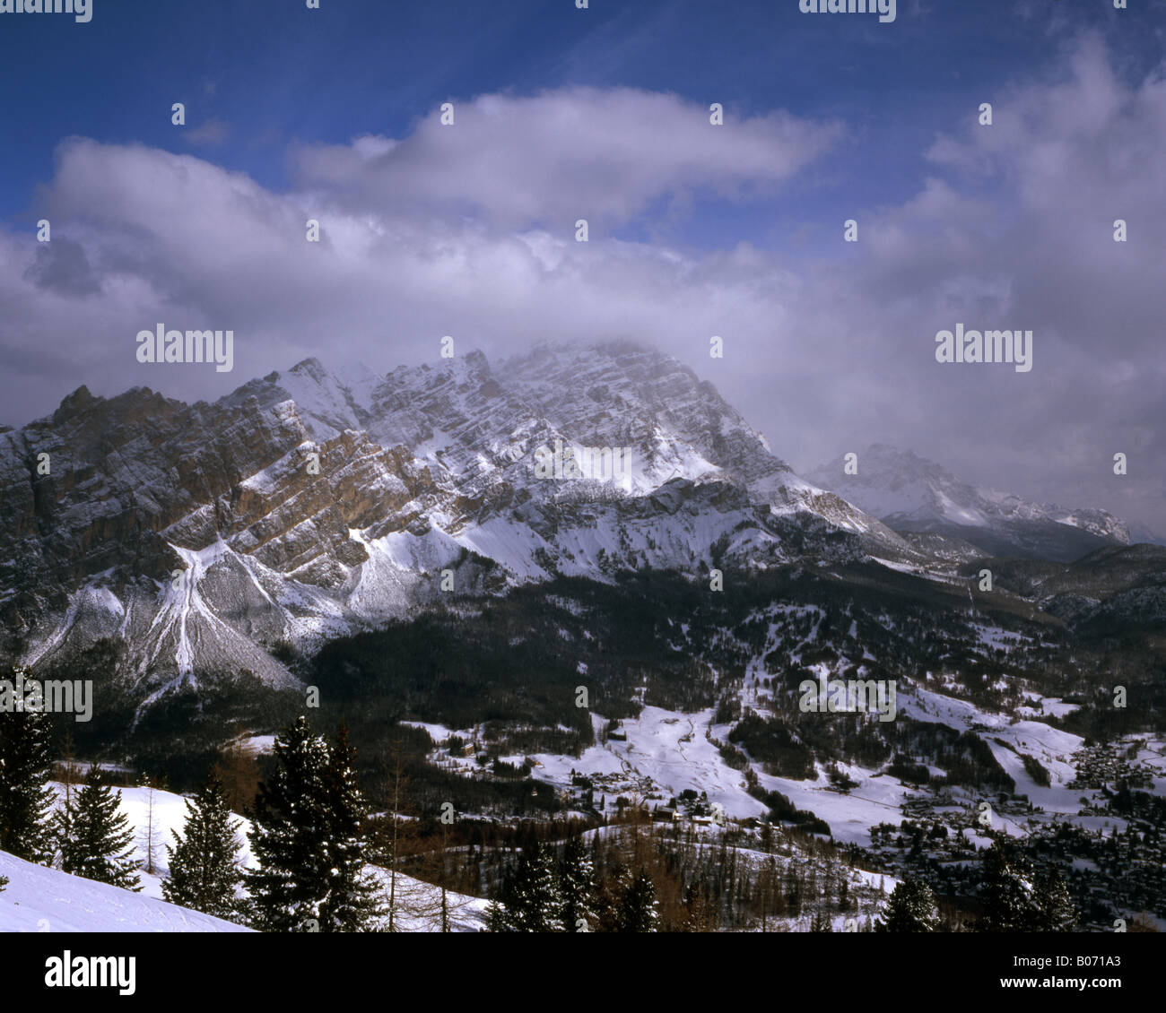 Massive limestone cliffs rising above Cortina D'ampezzo, The Dolomites ...