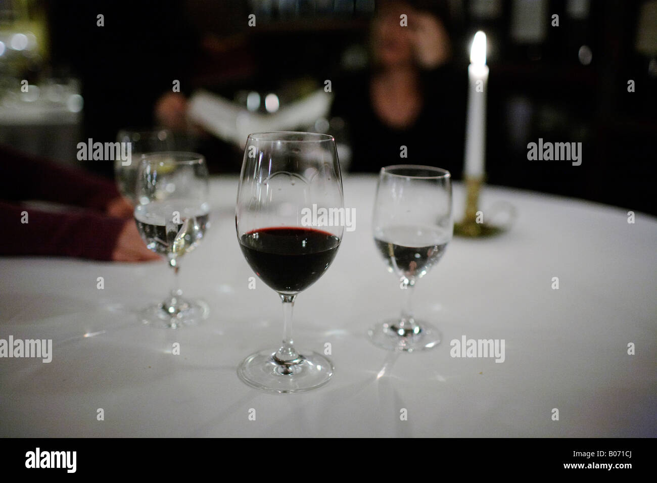 Glasses of red wine, on dining table Stock Photo - Alamy