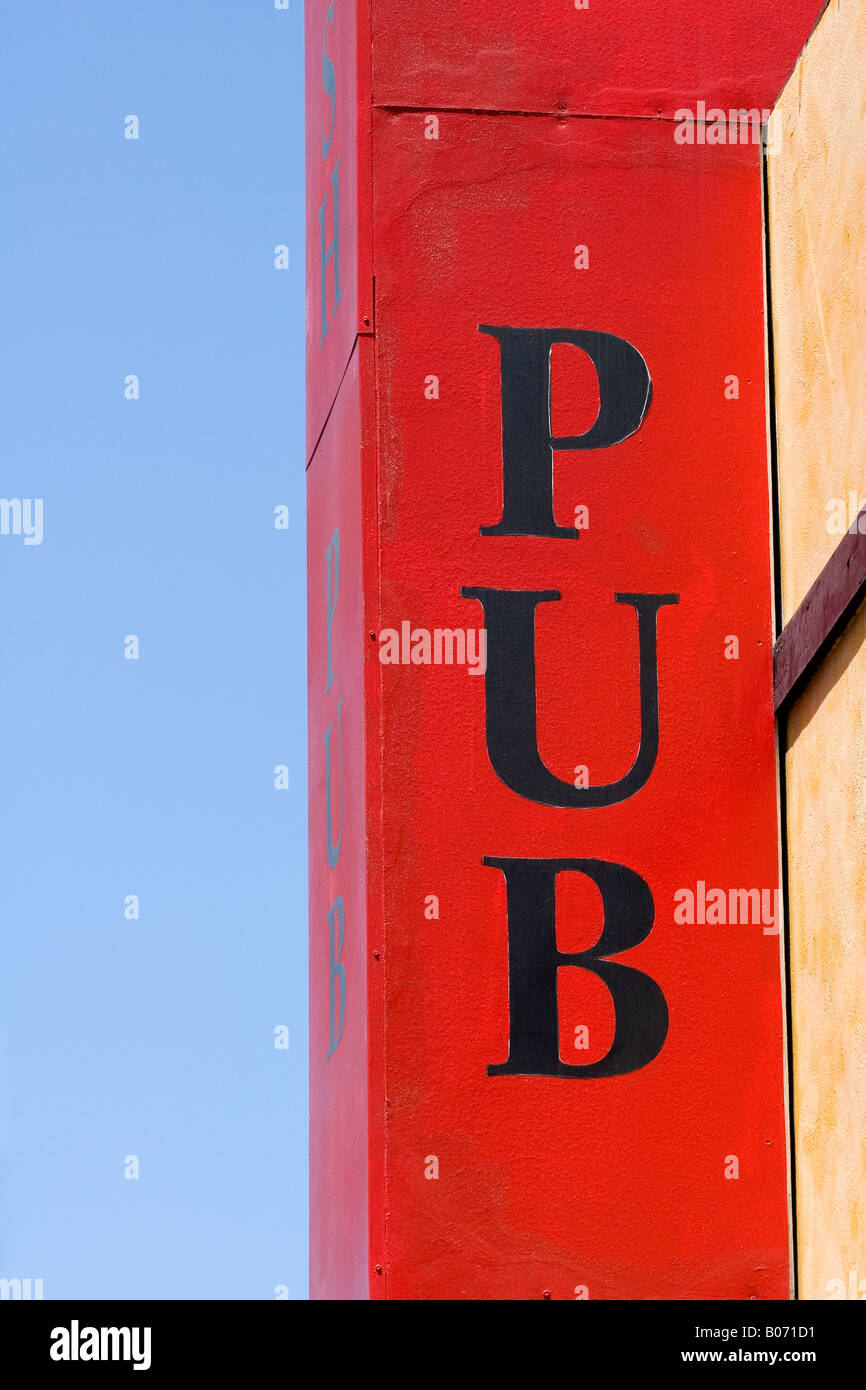 Bright red pub sign Stock Photo - Alamy