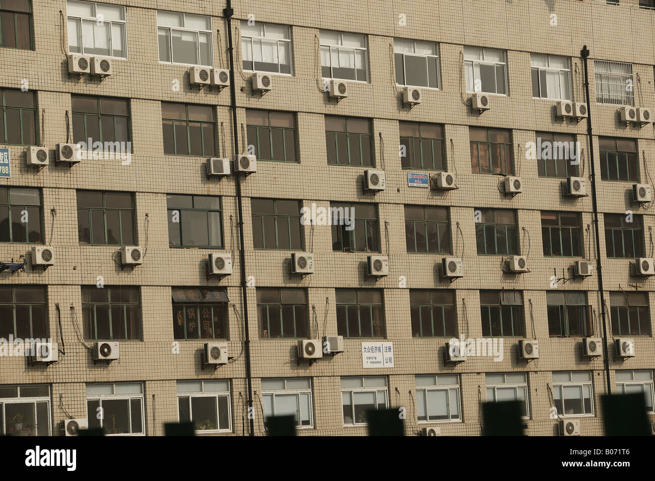 View of a Chinese commercial tower block close up focusing on the air ...