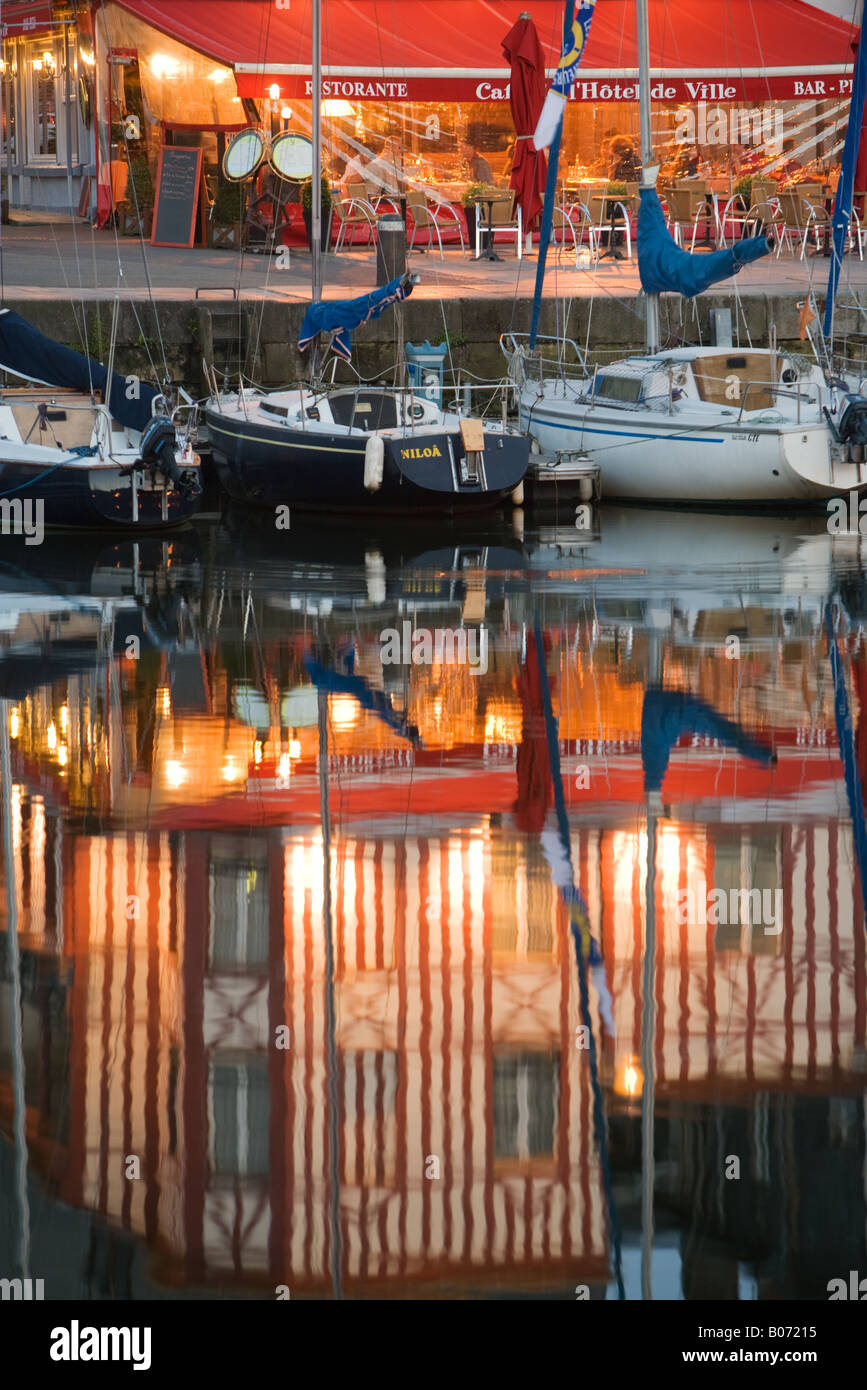 French harbour night time reflections of moored boats in the Honfluer ...