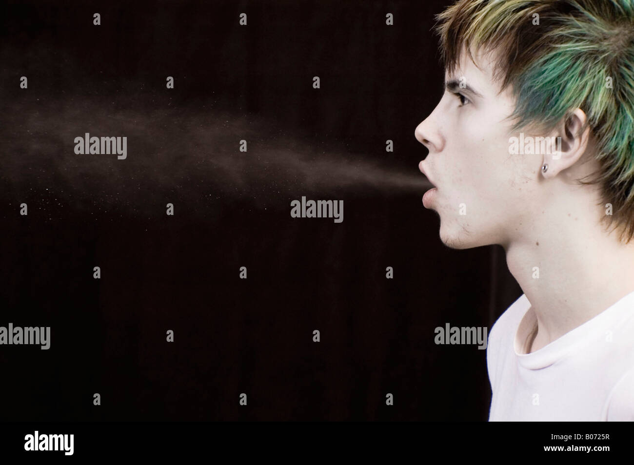 man blowing out Stock Photo - Alamy