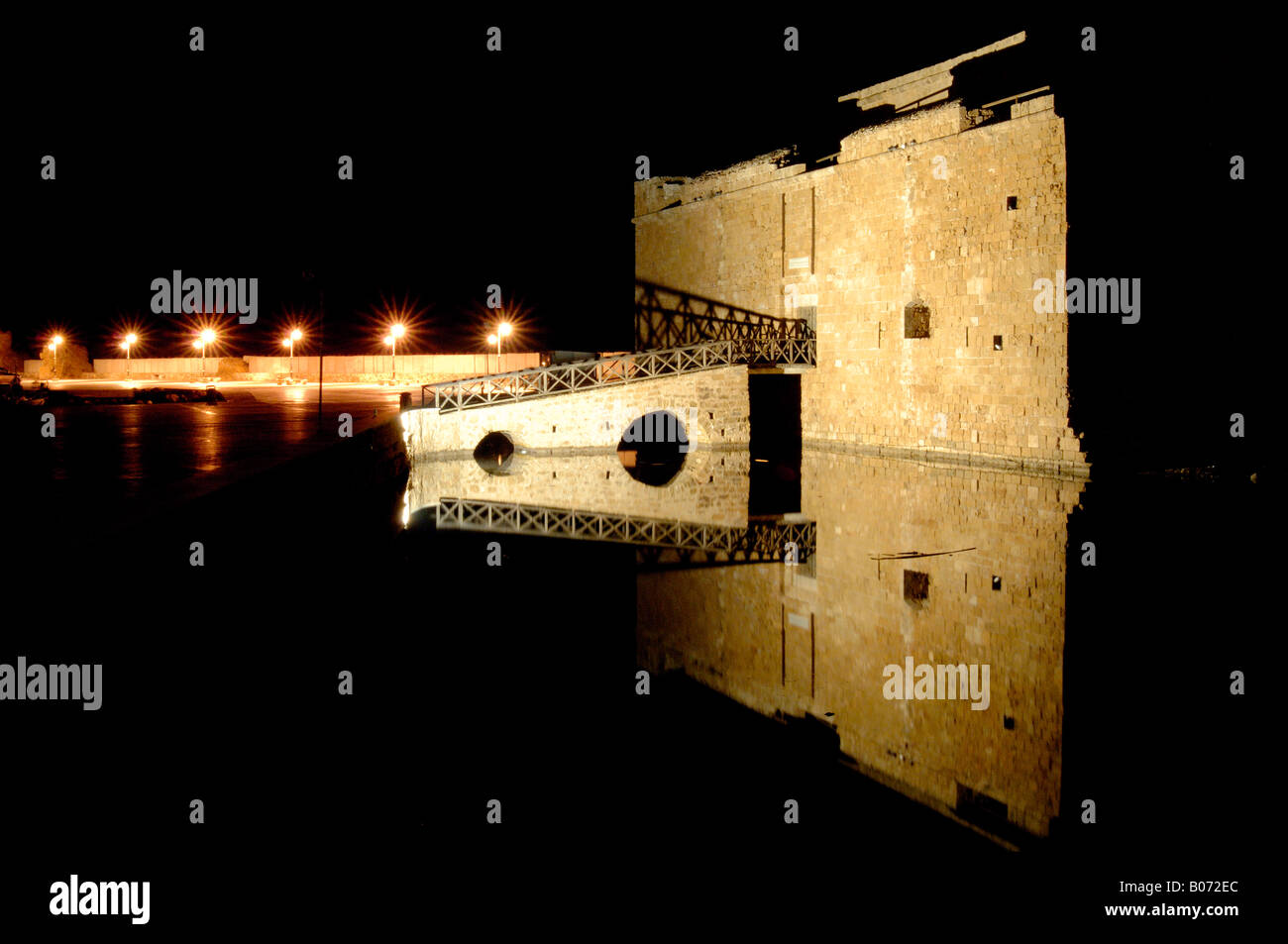 Paphos Castle at night reflected in the harbour waters, Paphos, Cyprus ...