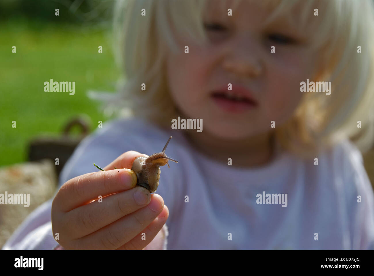 Playing with snail hi-res stock photography and images - Alamy