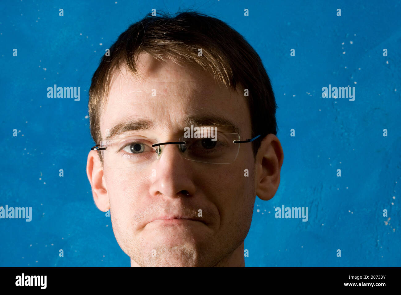 Young man making faces Stock Photo - Alamy