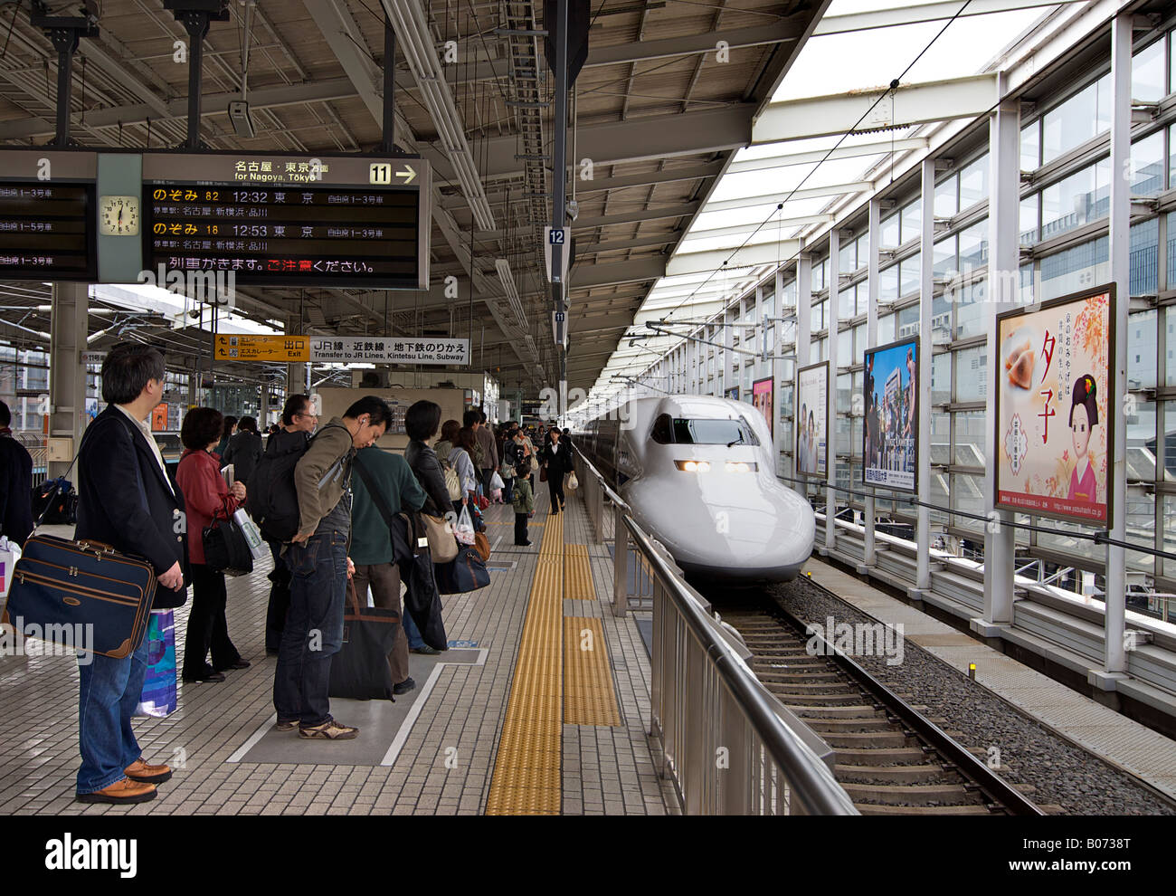 Passengers waiting board approaching shinkansen hi-res stock photography and images - Alamy