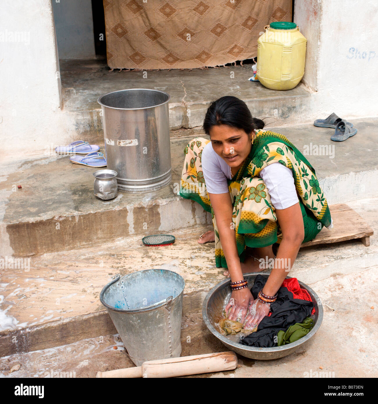 Lady washing clothes hi-res stock photography and images - Alamy