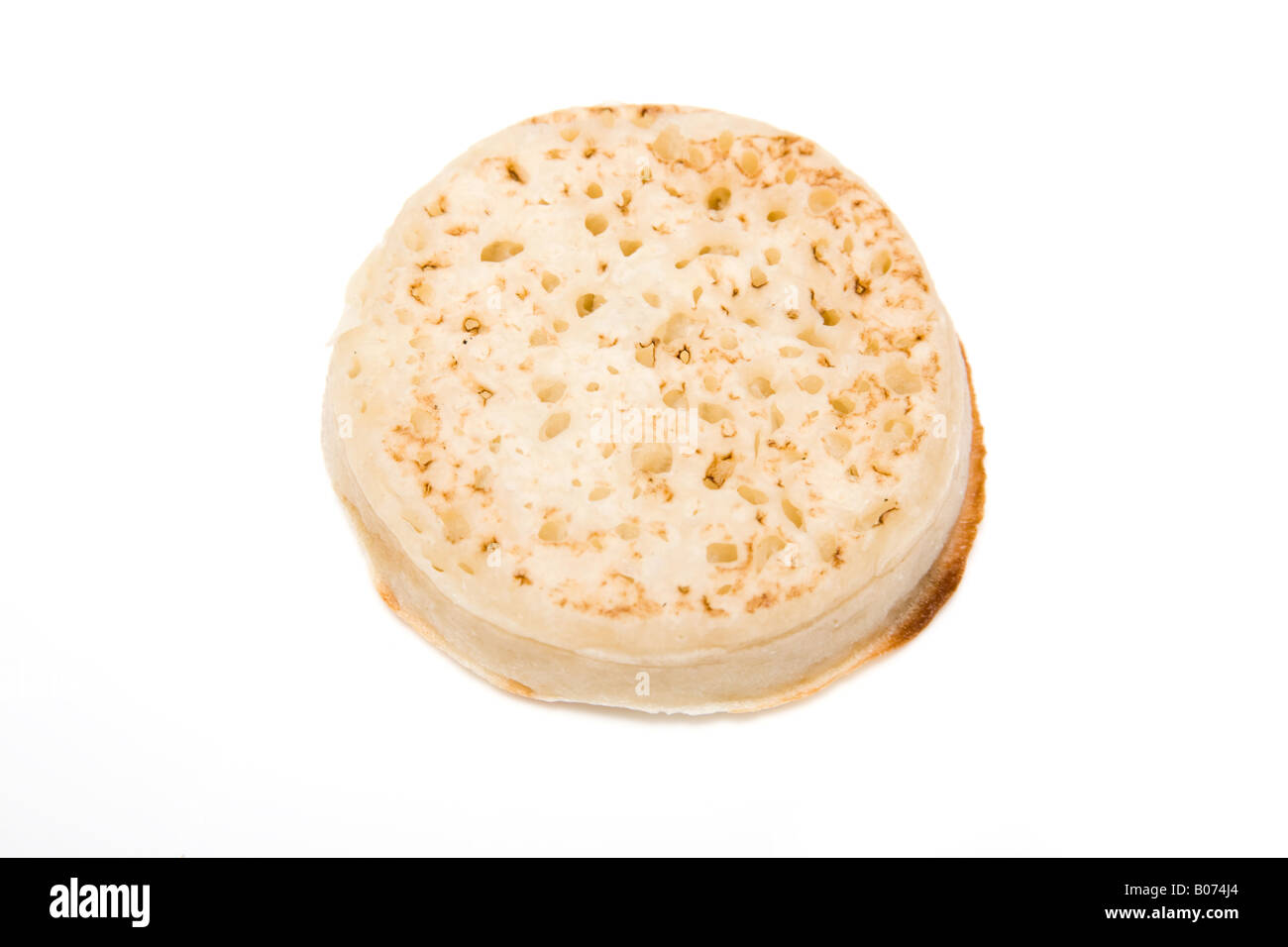 Crumpet isolated on a white studio background Stock Photo - Alamy