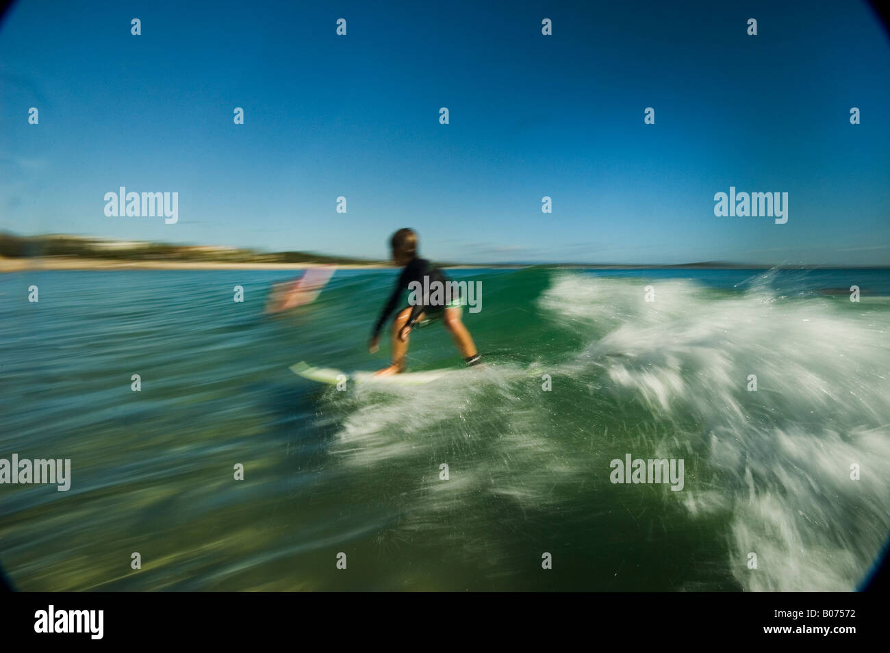 young boy surfing at Noosa Stock Photo - Alamy