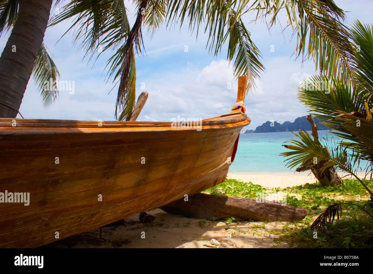 Local boats at tropical beach Stock Photo - Alamy