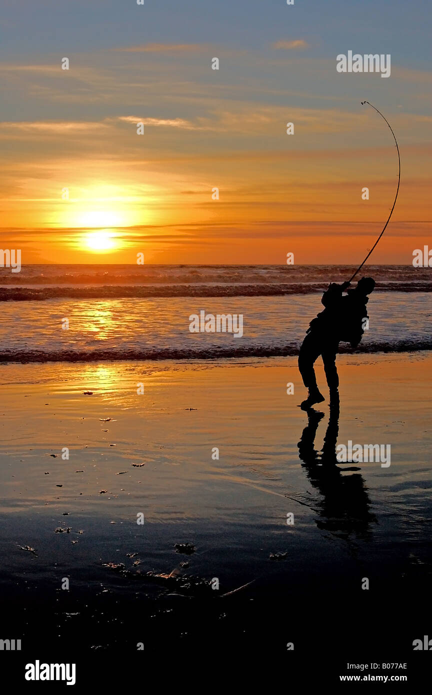 Fisherman at sunset Stock Photo - Alamy