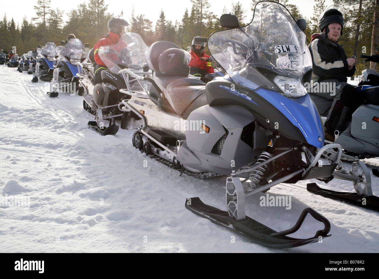 Front view of snowmobiles waiting for safari ride in Branas Ski Resort ...