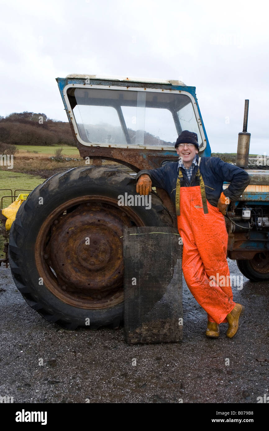Nick Turnbull portrait with tractor outside oyster sorting shed, Croig ...