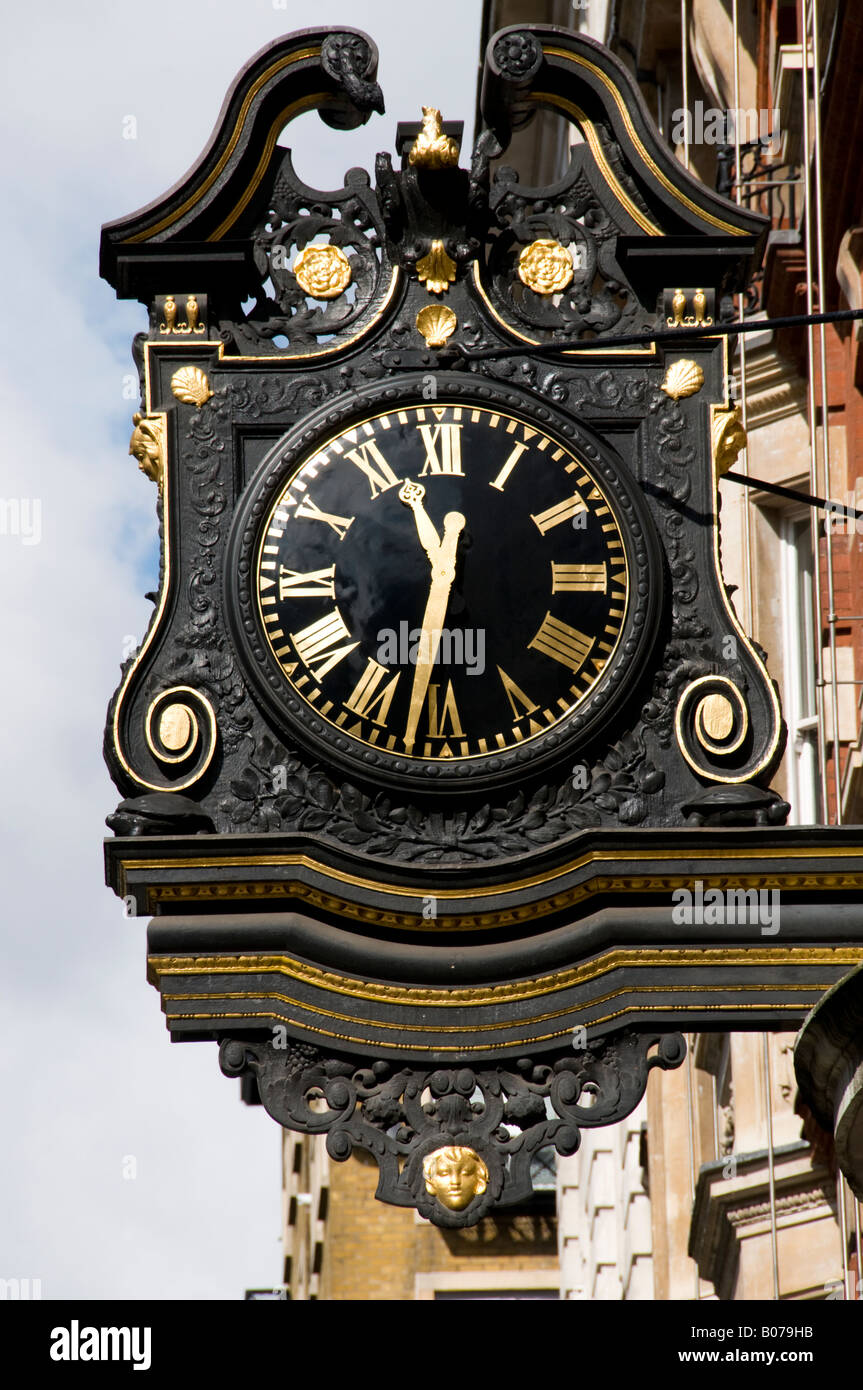 old clock on an old building in London Stock Photo - Alamy