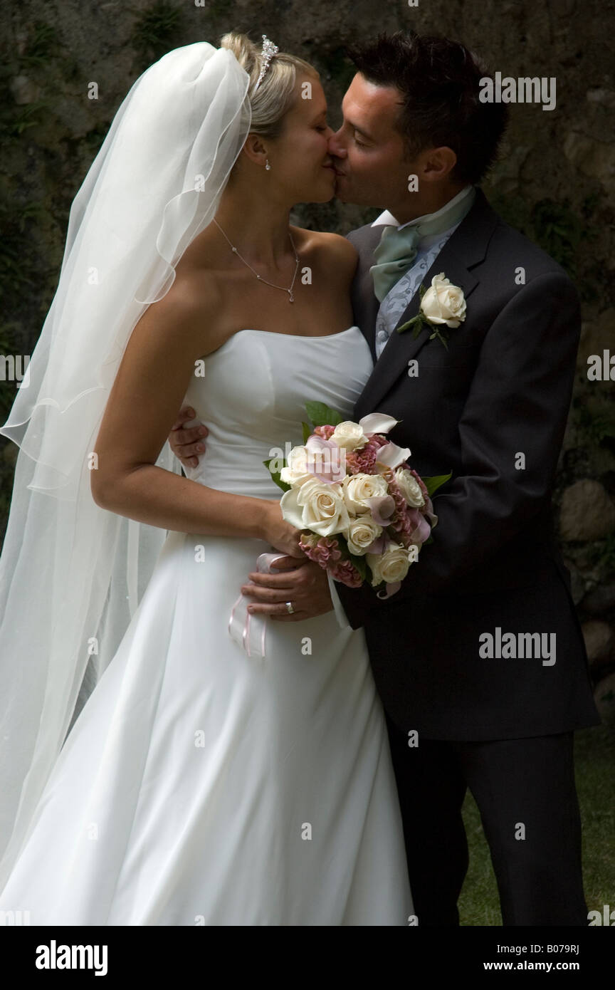 Bride and Groom kissing Stock Photo - Alamy
