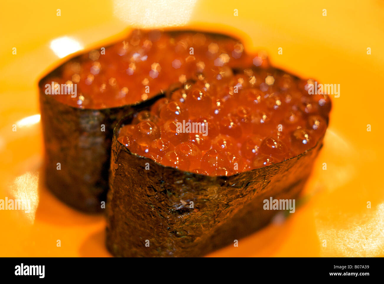 Onigiri. ikura. Roe. on a plate. Sushi restaurant, Japan Stock Photo ...