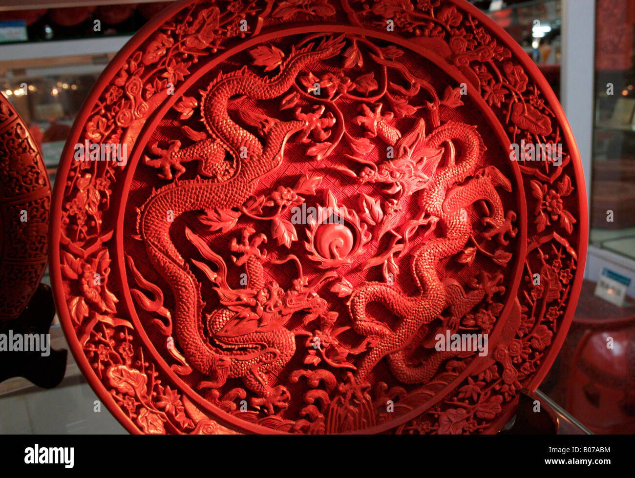 Red Beijing lacquer with dragon motif for sale in a crafts shop ...