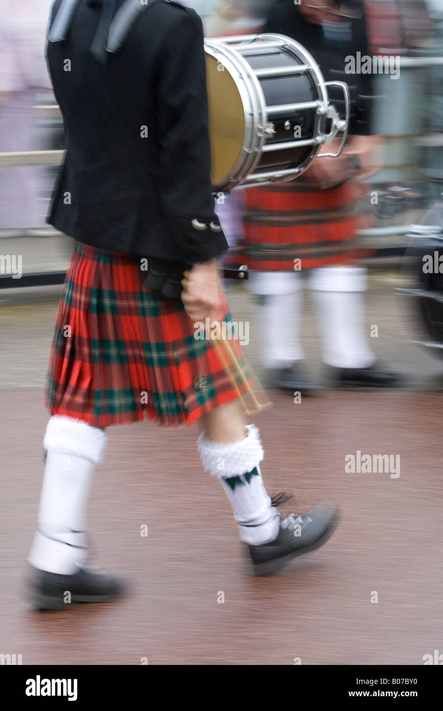 Pipe band playing for arrival of ferry at Craignure Pier, Isle of Mull ...