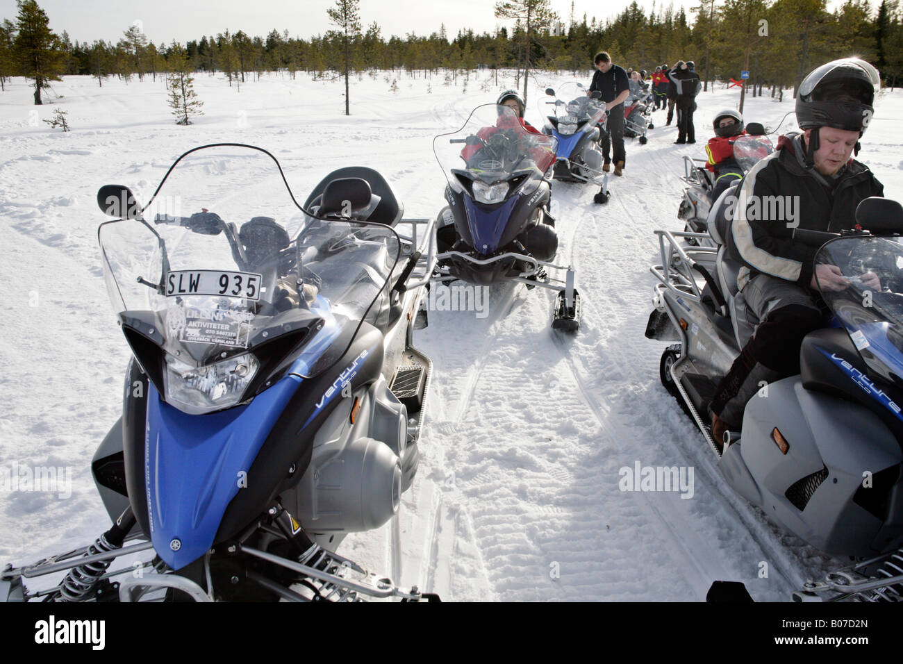 Front view of snowmobiles waiting for safari ride in Branas Ski Resort ...