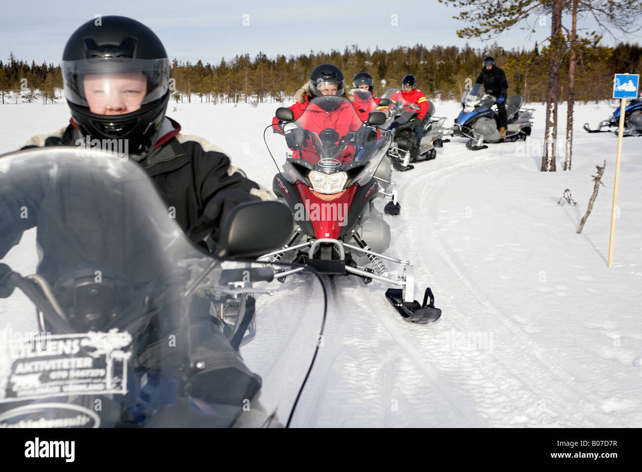 Front view of snowmobiles in line formation on travel in Branas Ski ...