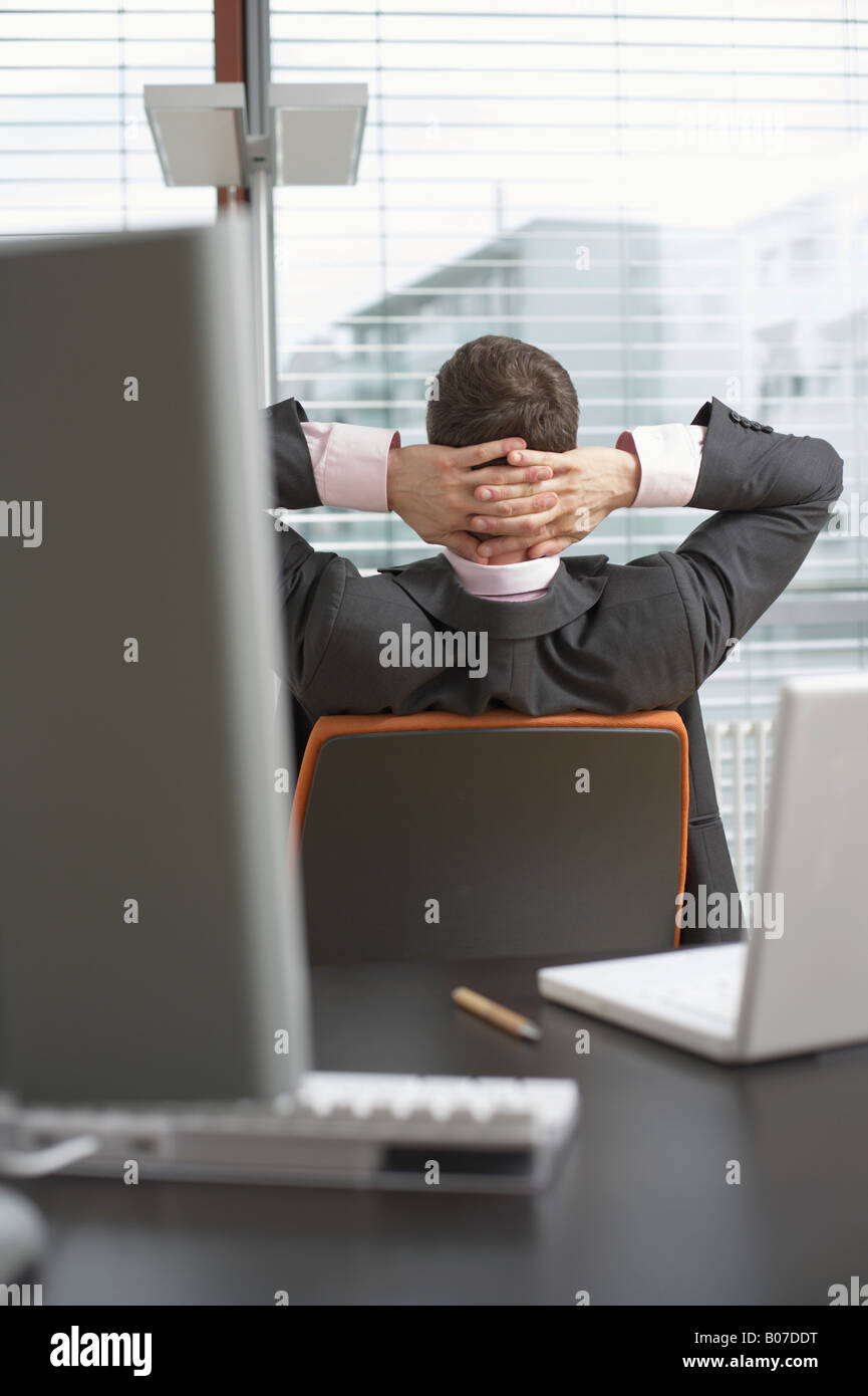 Man in office, rear view Stock Photo - Alamy