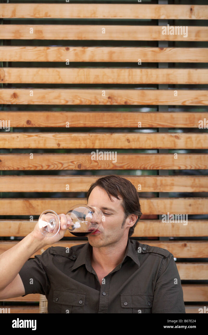 Man drinking a glass of red wine Stock Photo - Alamy