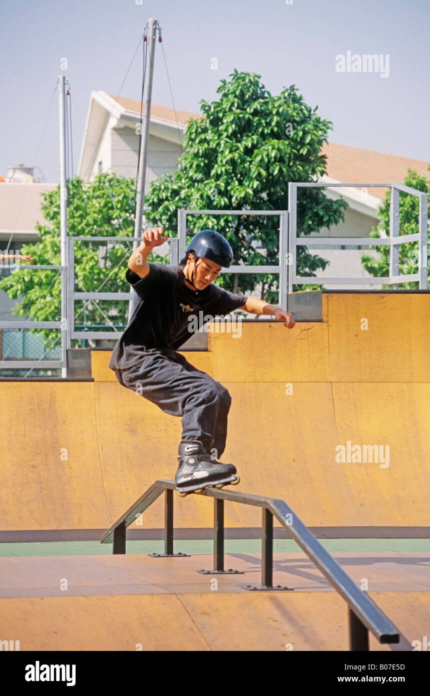 Inline Skater Riding The Rail In Skate Park Taichung Taiwan Stock Photo ...