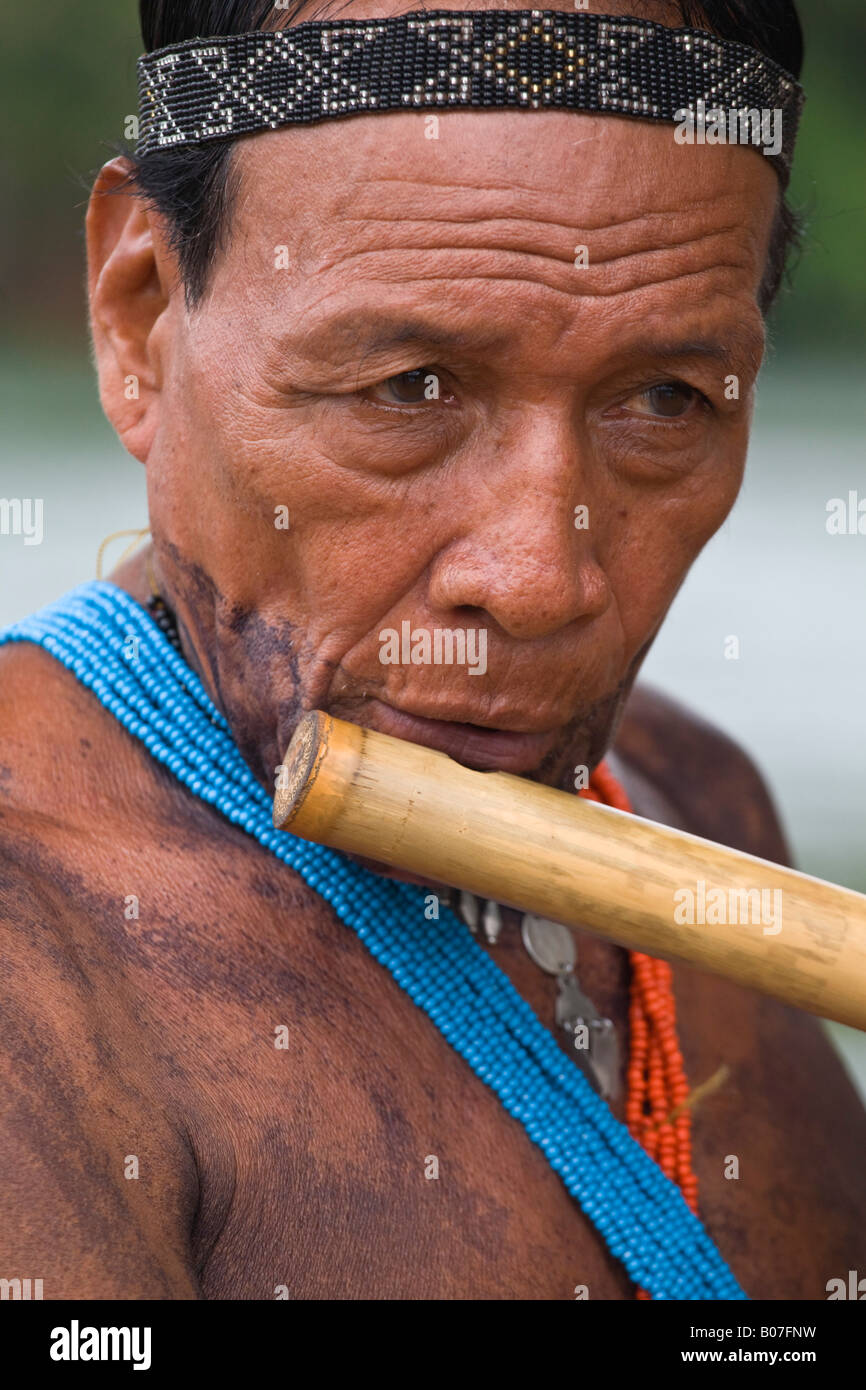 Panama, Chagres River, Embera Village, Embera man paying musical ...