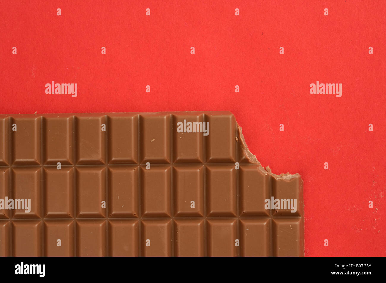 Bitten bar of chocolate Stock Photo - Alamy