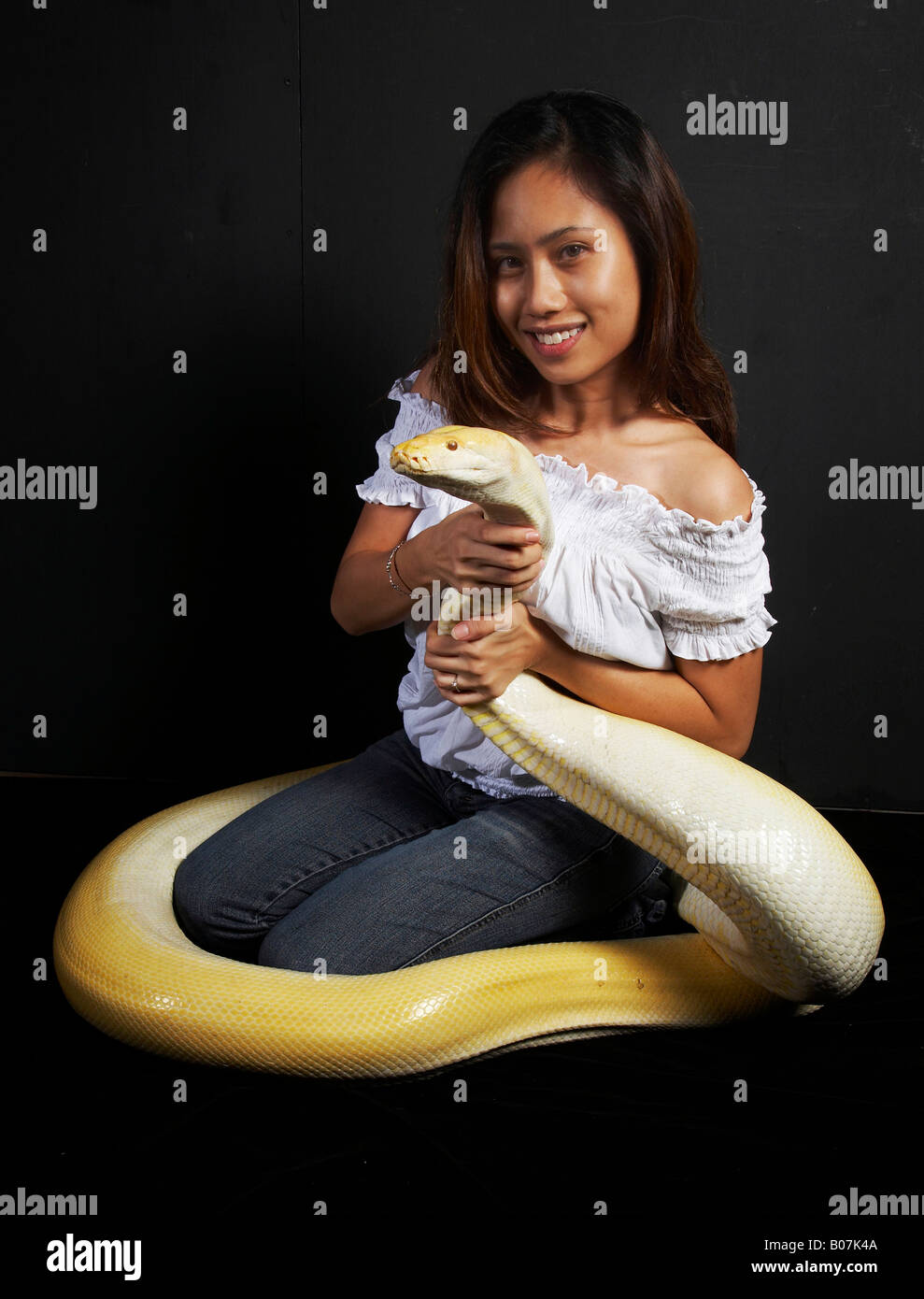 A woman with huge Albino Python Stock Photo - Alamy