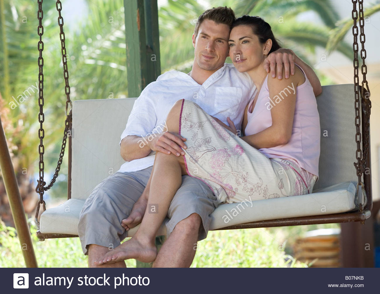 Couple Relaxing On Swing Stock Photos & Couple Relaxing On Swing Stock ...