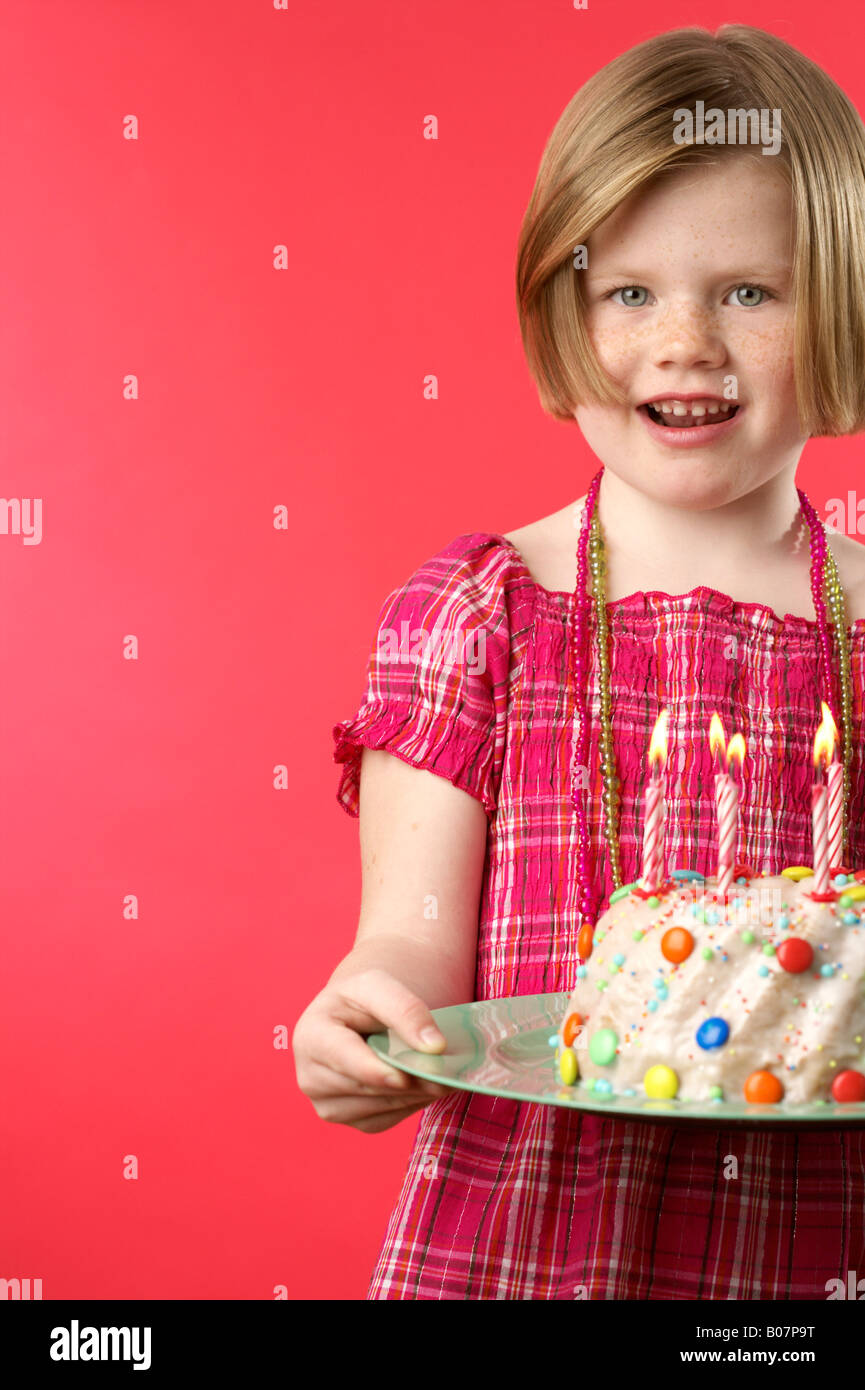 Girl holding a birthday cake Stock Photo - Alamy