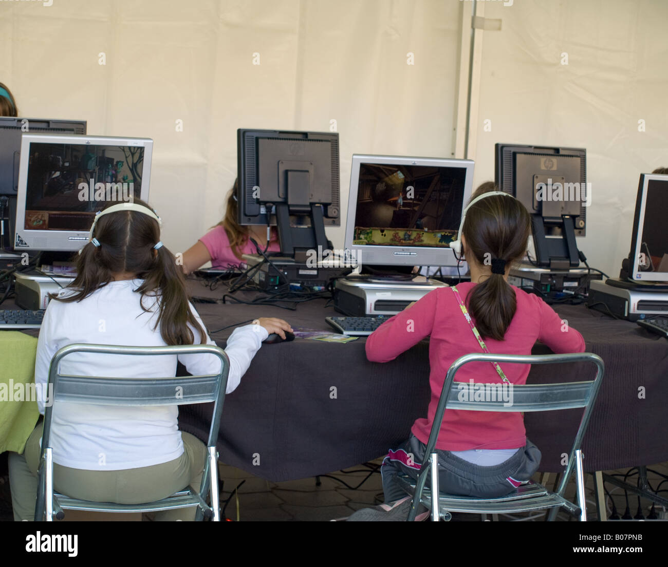 Kids plays with computers Stock Photo - Alamy