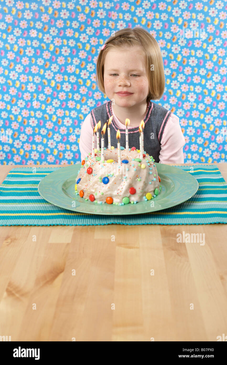 Girl sitting in front cake hi-res stock photography and images - Alamy