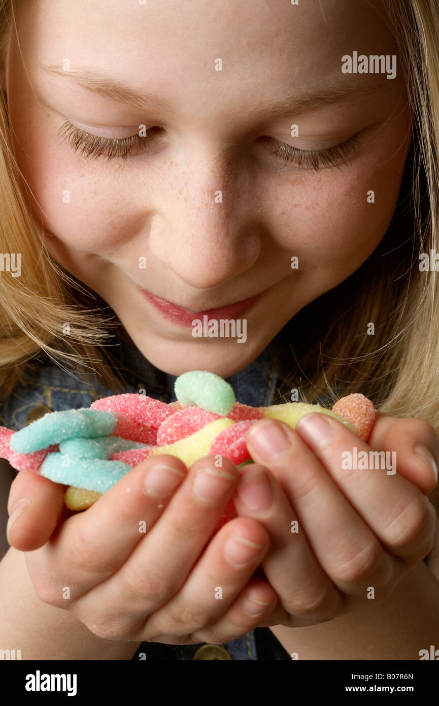 Girl with sweets Stock Photo - Alamy