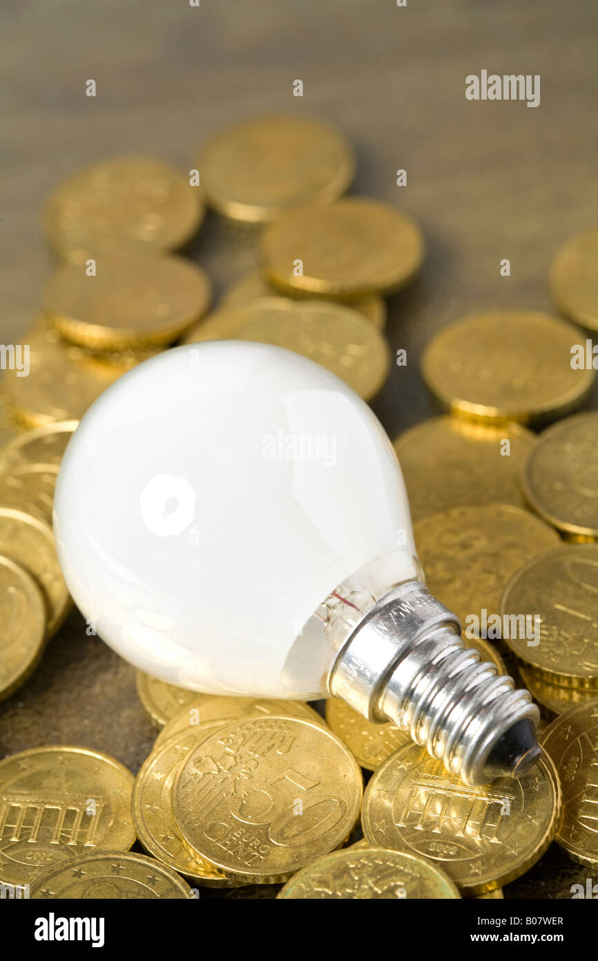 Light bulb on coins hi-res stock photography and images - Alamy