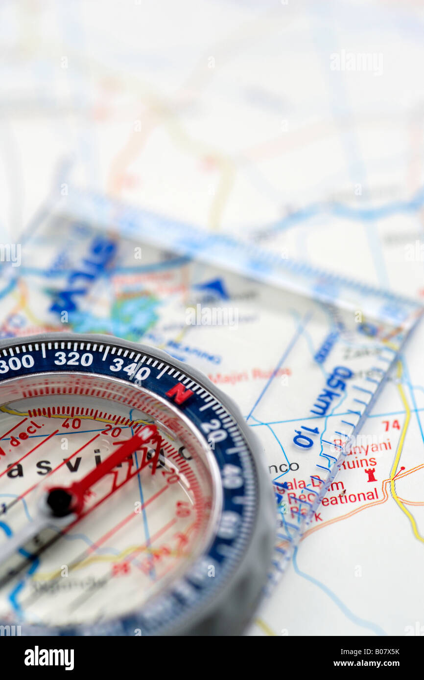 Compass on map Stock Photo - Alamy