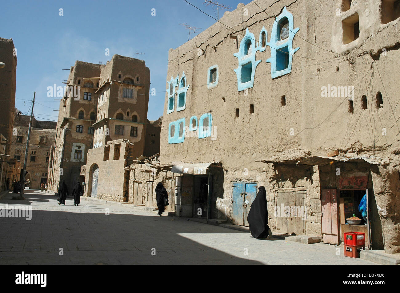 In Amran, Yemen, houses are still built of mudbricks and straw, a shop ...