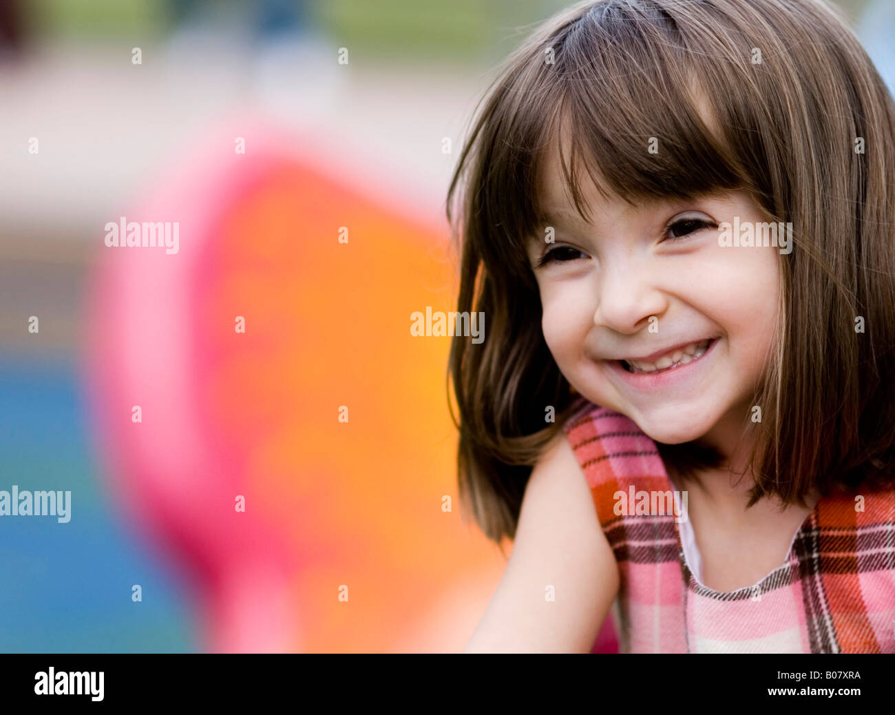 Happy smiling pretty little girl playing in park Stock Photo - Alamy